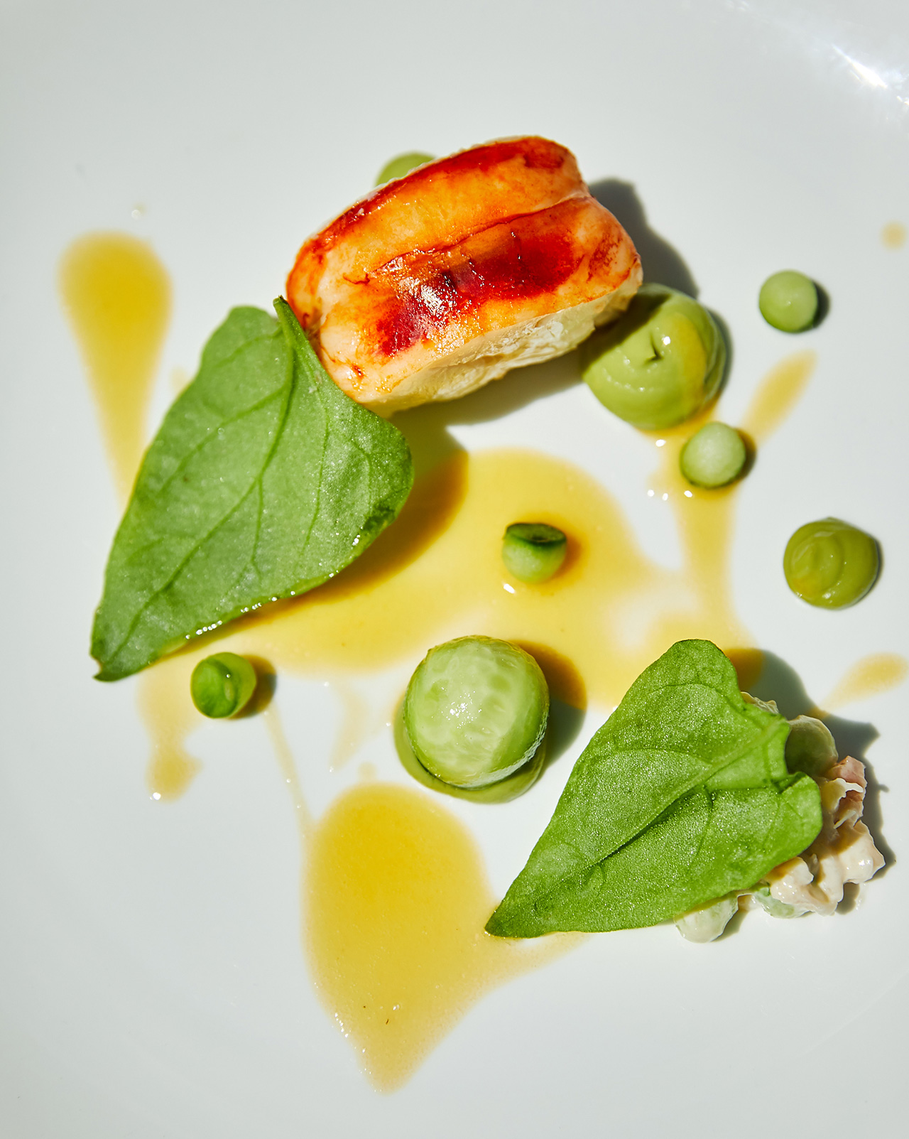 Chef Josh Lopez's painted crayfish is a work of edible art