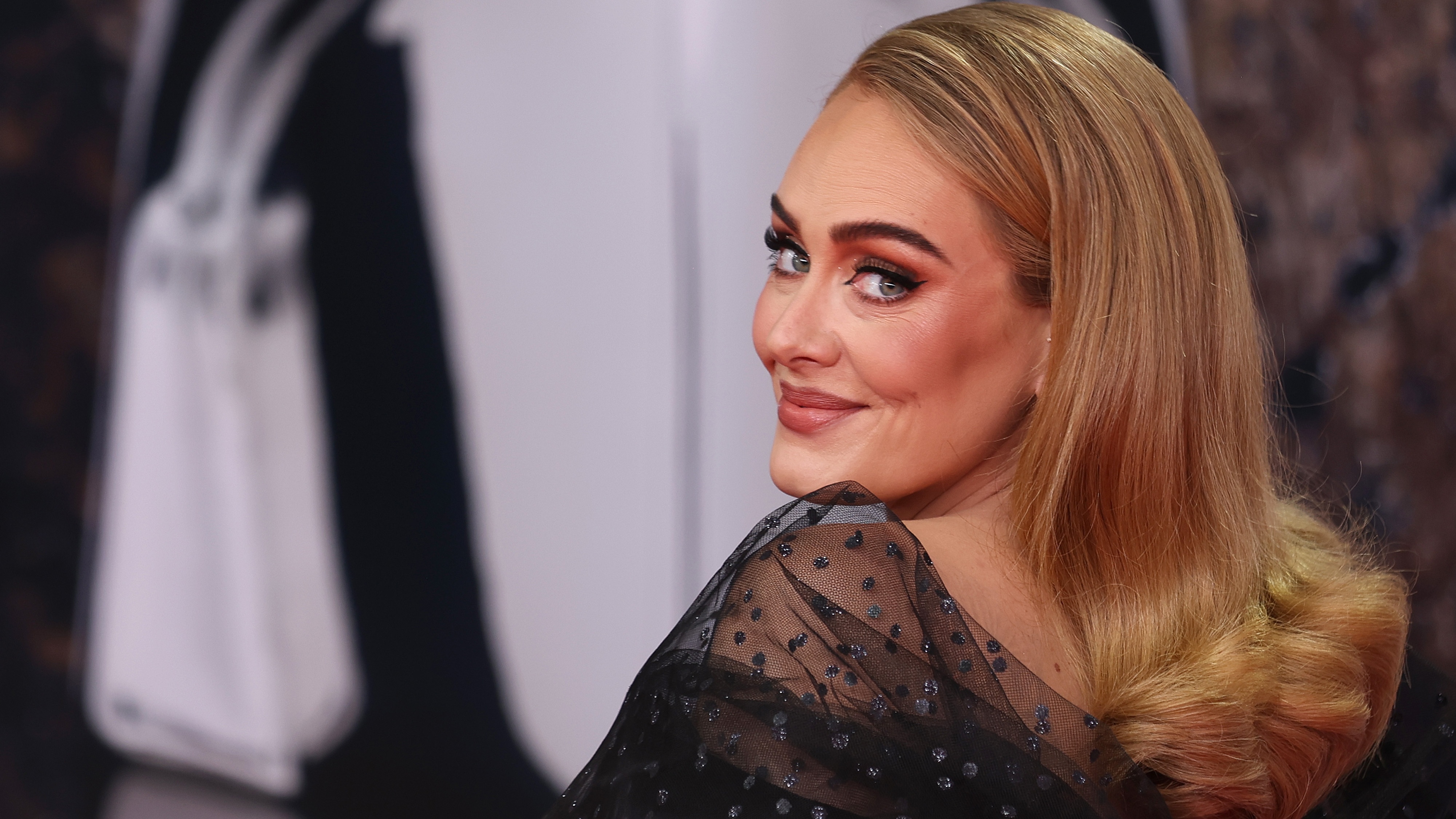 Adele Walks Red Carpet Wearing Giorgio Armani And Engagement Ring